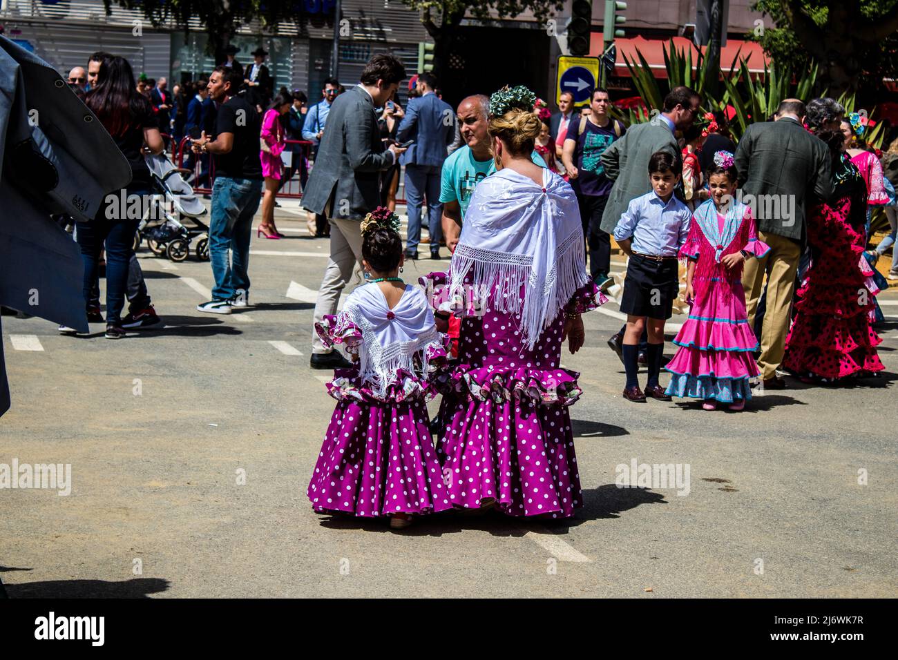 Seville, Spain - May 01, 2022 Sevillians dressed in traditional ...