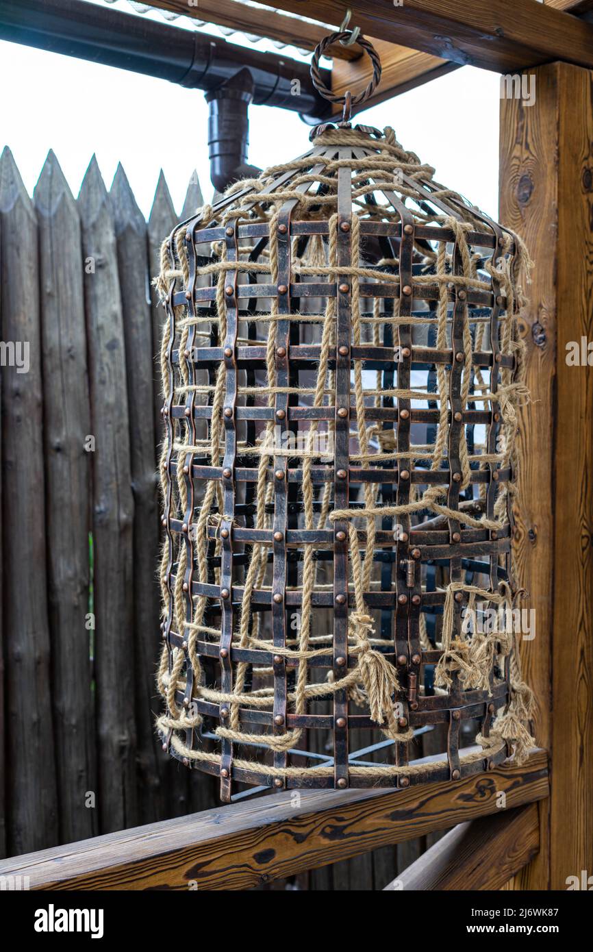 The designer bird cage is made in the old style. The iron cage is ...