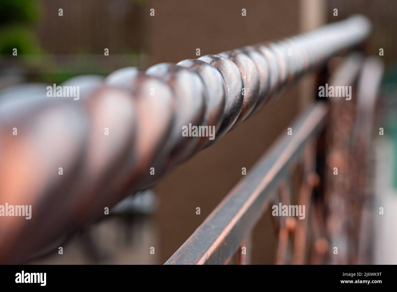Wrought and twisted iron handrails. Metal products. Stylization of ...
