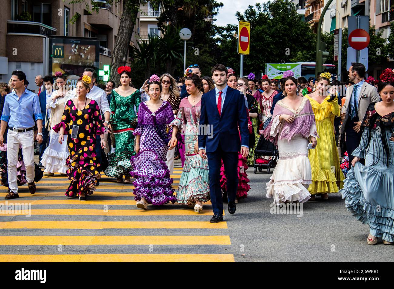 Seville, Spain - May 01, 2022 Sevillians dressed in traditional ...