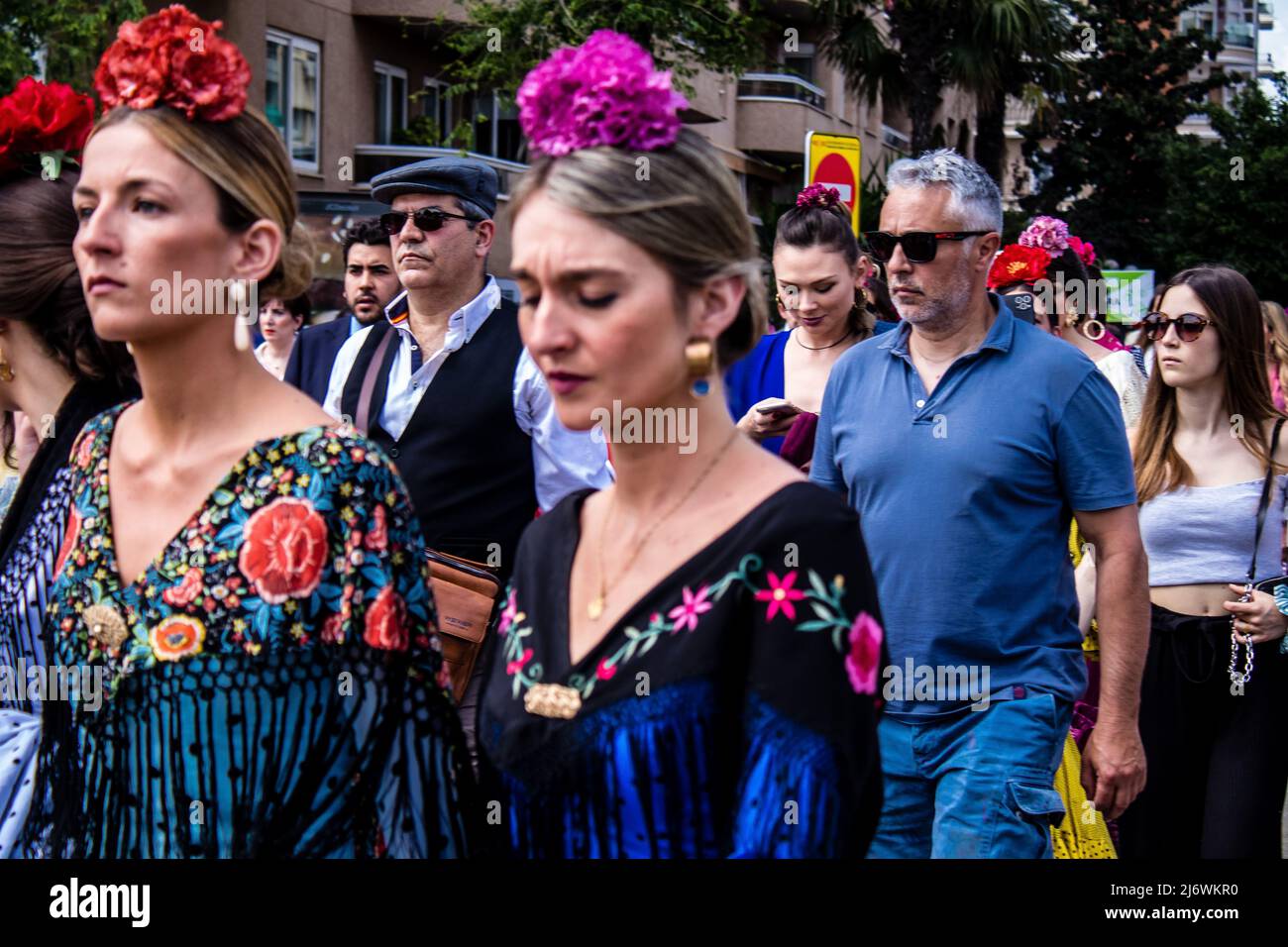 Seville, Spain - May 01, 2022 Sevillians dressed in traditional ...