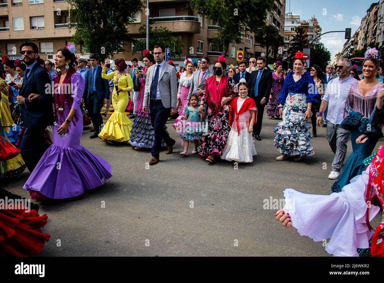 Seville, Spain - May 01, 2022 Sevillians dressed in traditional ...