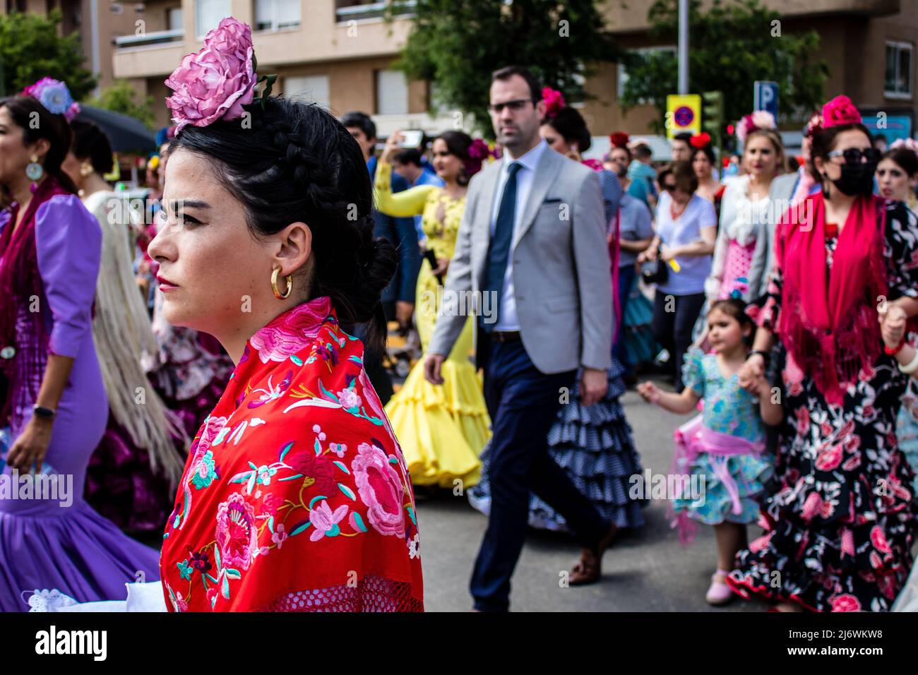 Seville, Spain - May 01, 2022 Sevillians dressed in traditional ...