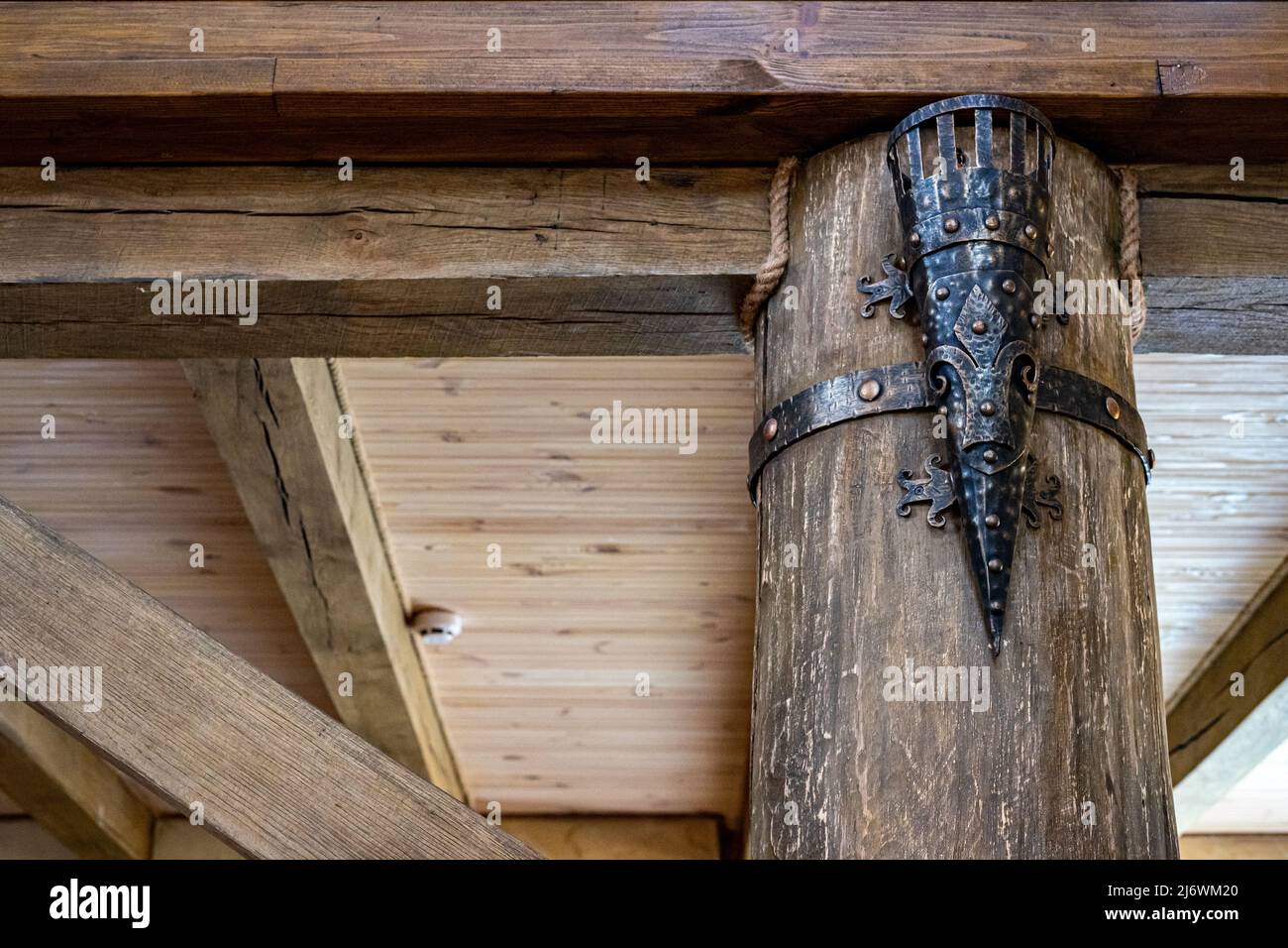 Ancient torch. Wooden interior. Elements of decor in the old style ...