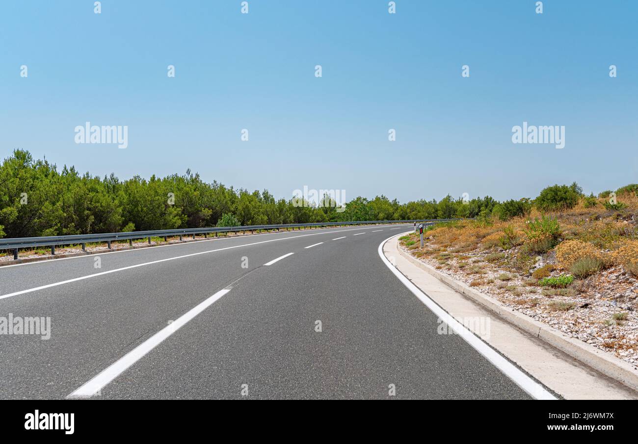 Scenic road. Road is surrounded by a magnificent natural landscape ...