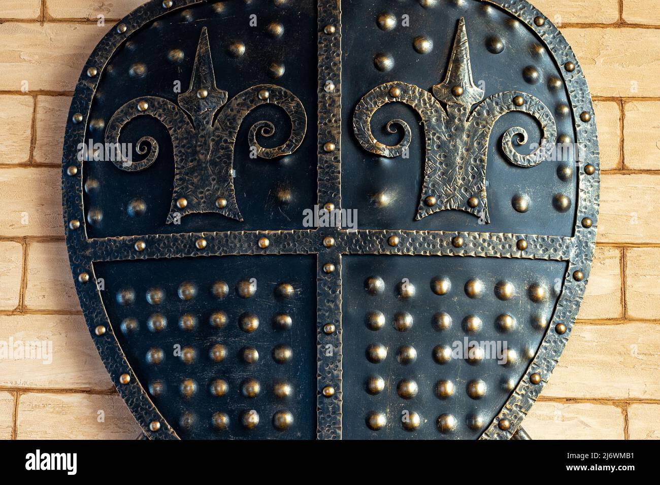 The interior design. A metal shield hangs on the wall as a decoration ...