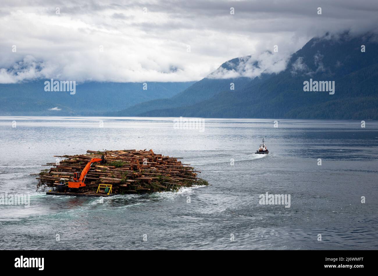 Logging Barge Being Towed By A Tug Boat On The Inside Passge Alaska ...
