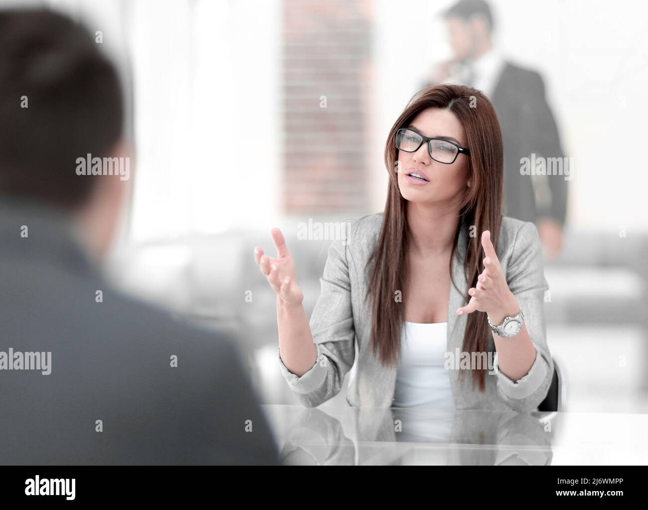 Manager talking with a client in a modern office Stock Photo - Alamy