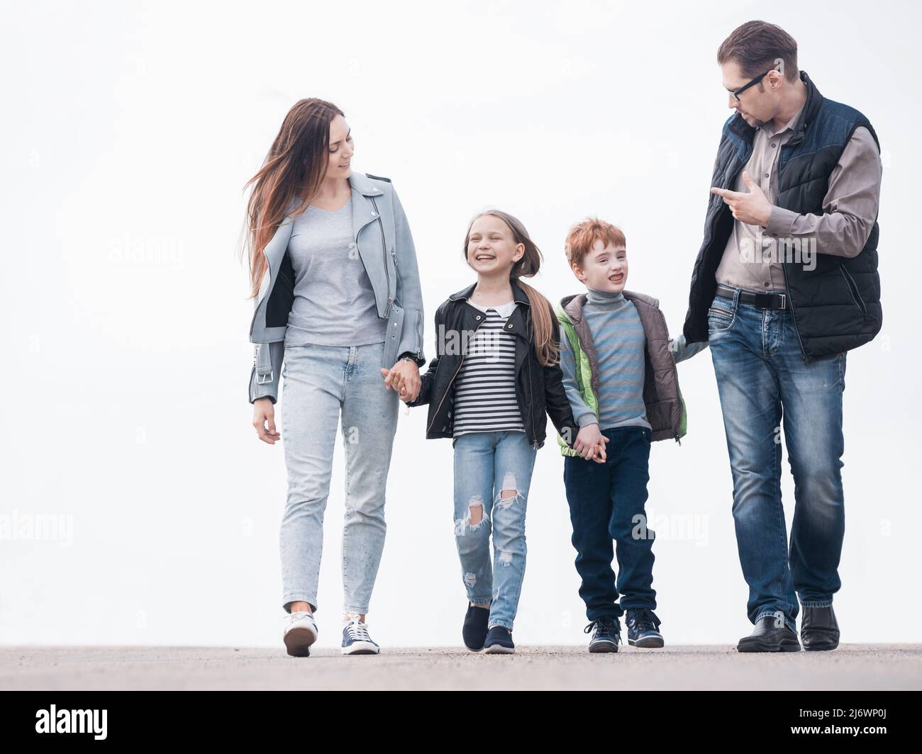 parents discussing that the with their children during walk Stock Photo ...