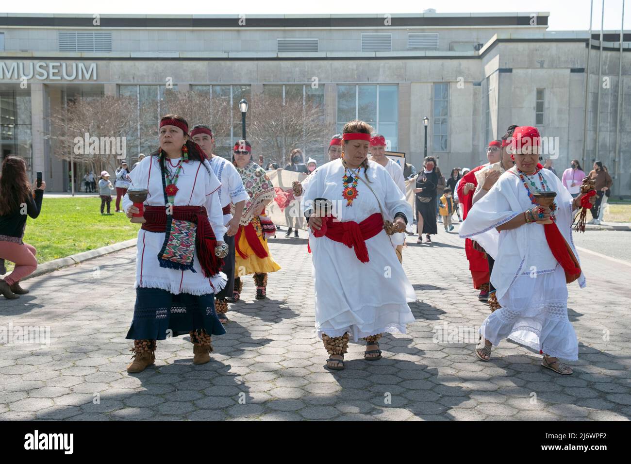 Dancers from the Calpulli Mexican Dance Group march, dance, celebrate ...