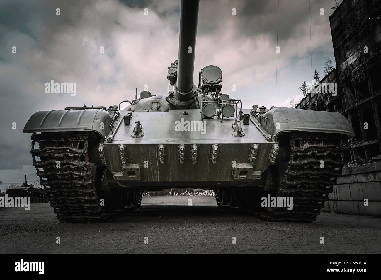 old soviet tank on the background of destroyed houses. The concept of ...