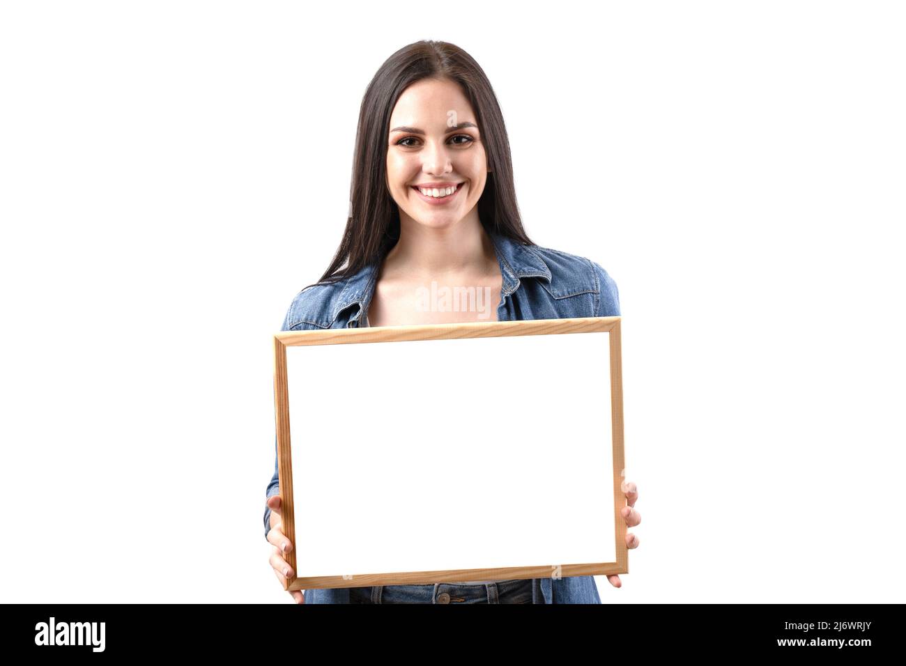 Happy smiling woman holding a placard on a white background in the ...