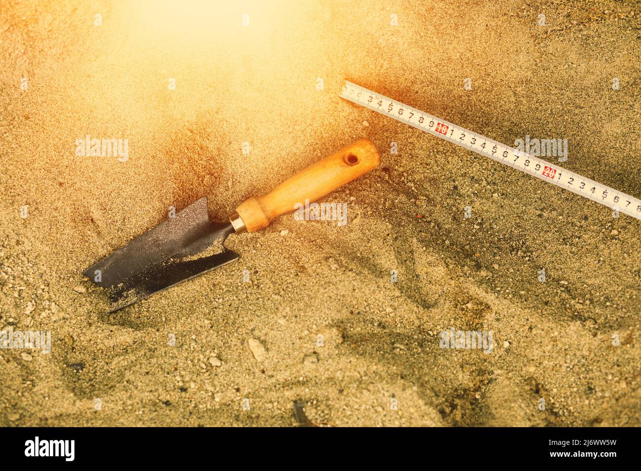 Shovel in the sand.Skeleton and archaeological tools.Digging for ...