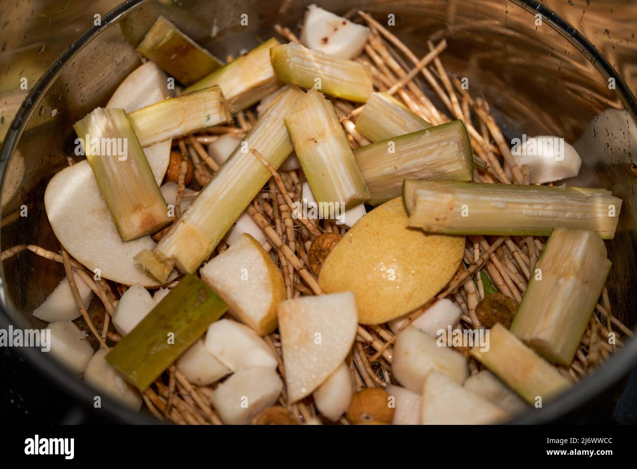A pot of Cantonese traditional herbal tea, choke root sugar cane water ...