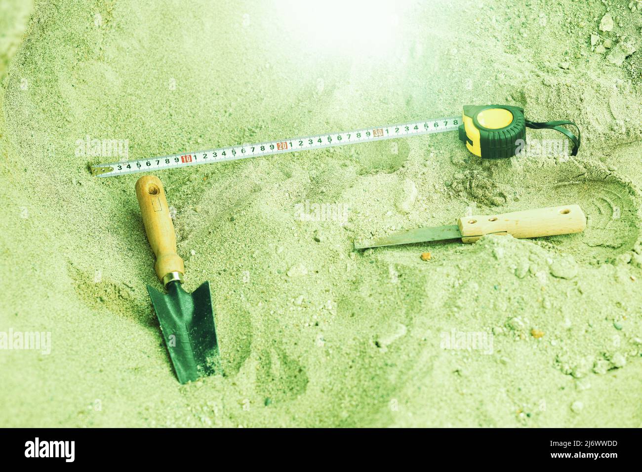 Shovel in the sand.Skeleton and archaeological tools.Digging for ...