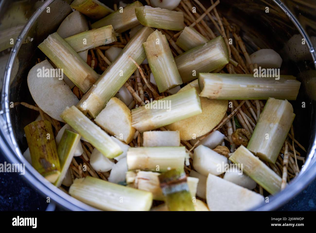 A pot of Cantonese traditional herbal tea, choke root sugar cane water ...