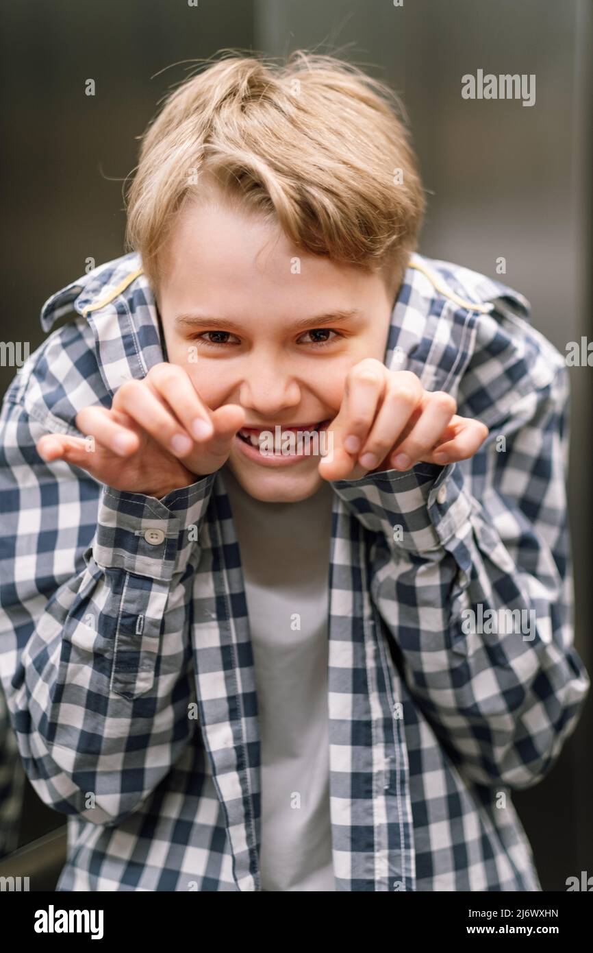 Cheerful teenager blond makes faces, indulges and fools around Stock ...