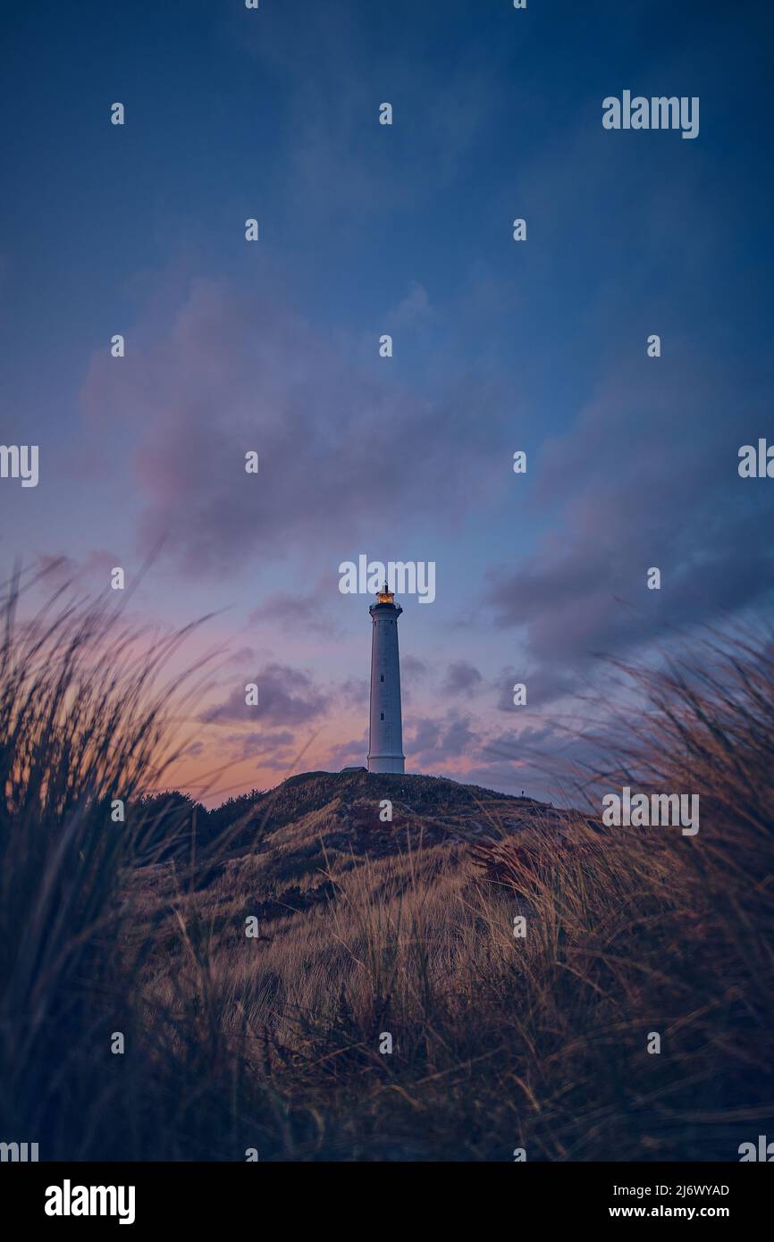 Famous lighthouse lyngvig fyr at the danish coast bevfore sunrise. High ...