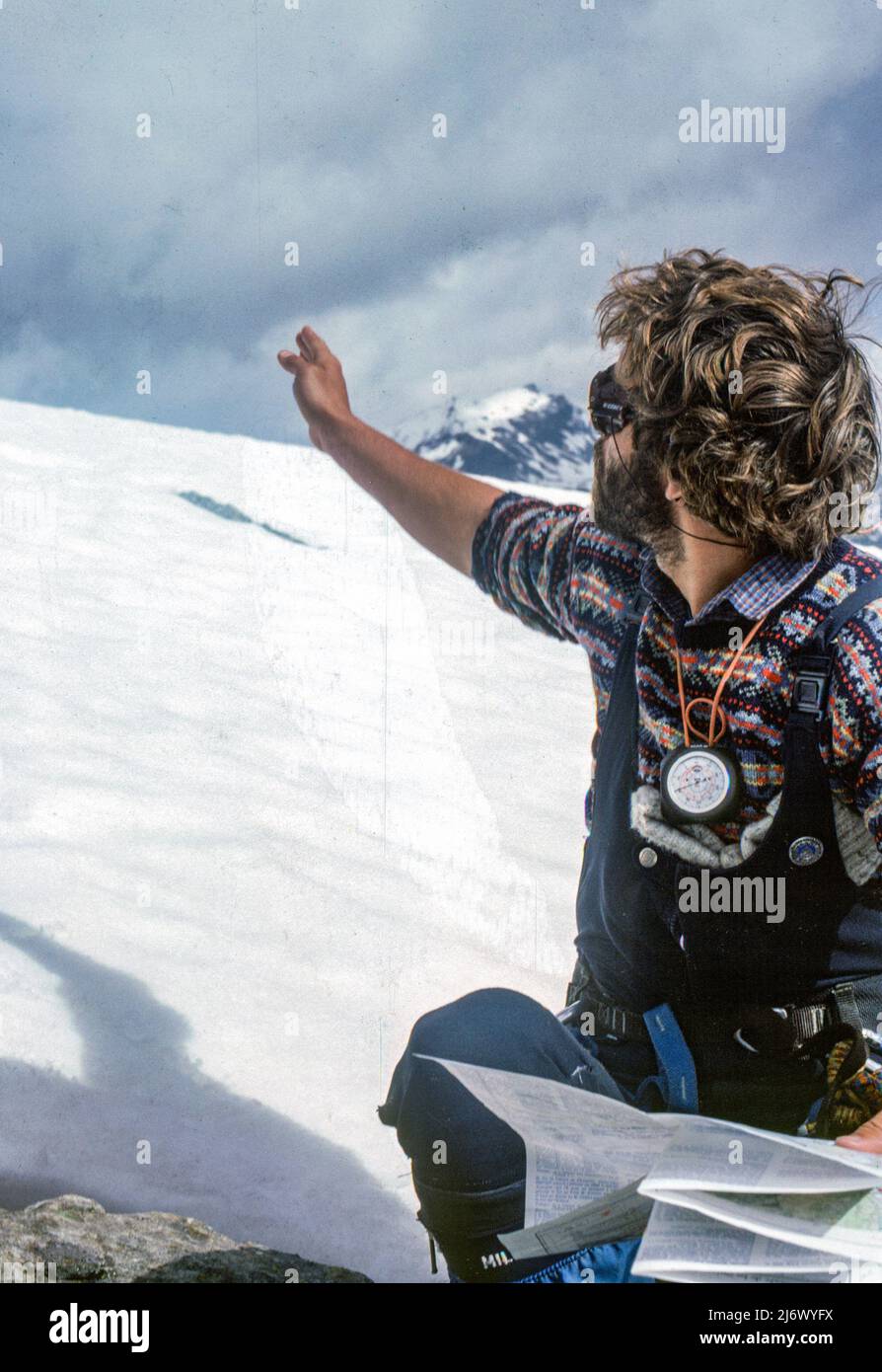 A mountain guide in the Swiss Alps Switzerland points the way ...