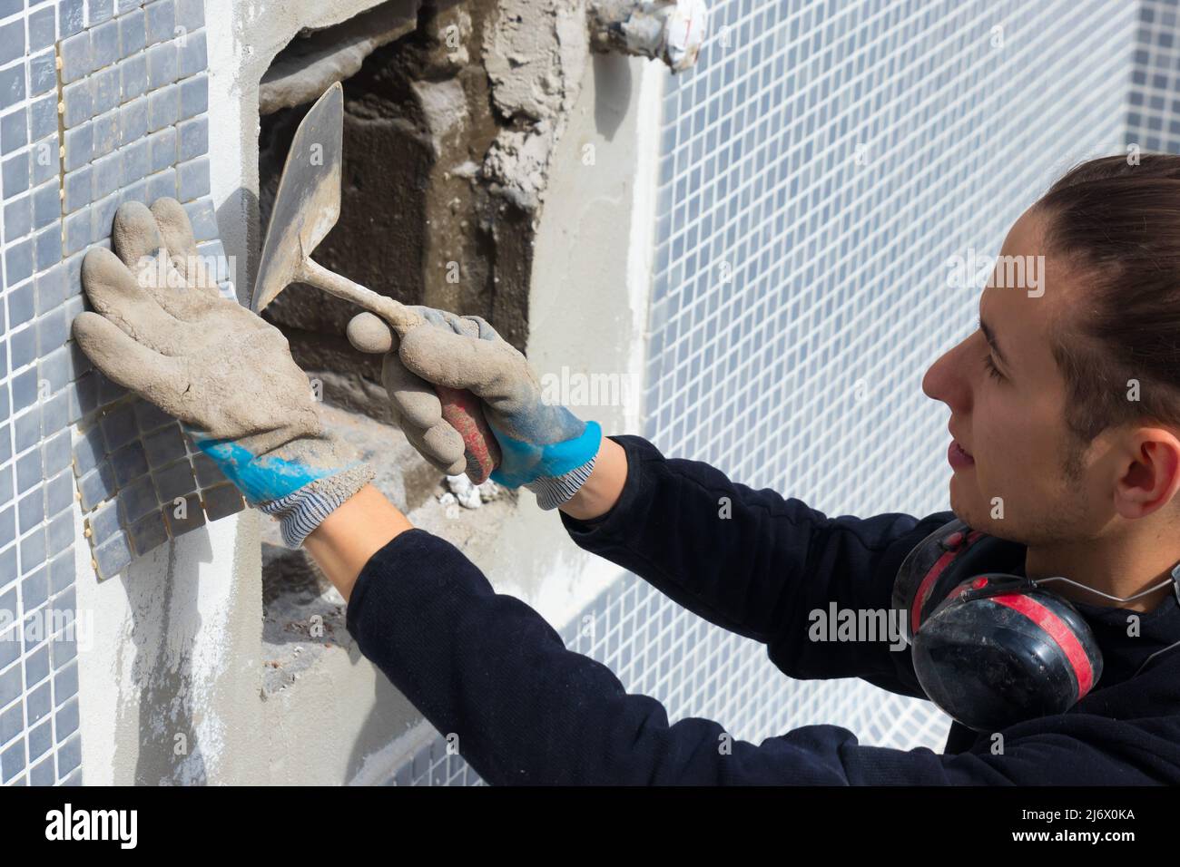 Installing the tiles hi-res stock photography and images - Alamy