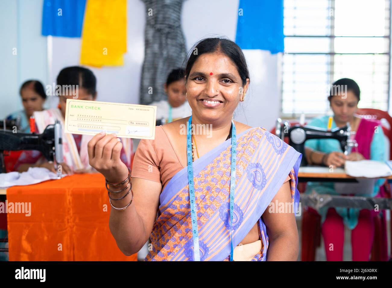 Happy textile factory worker indian hi-res stock photography and images ...