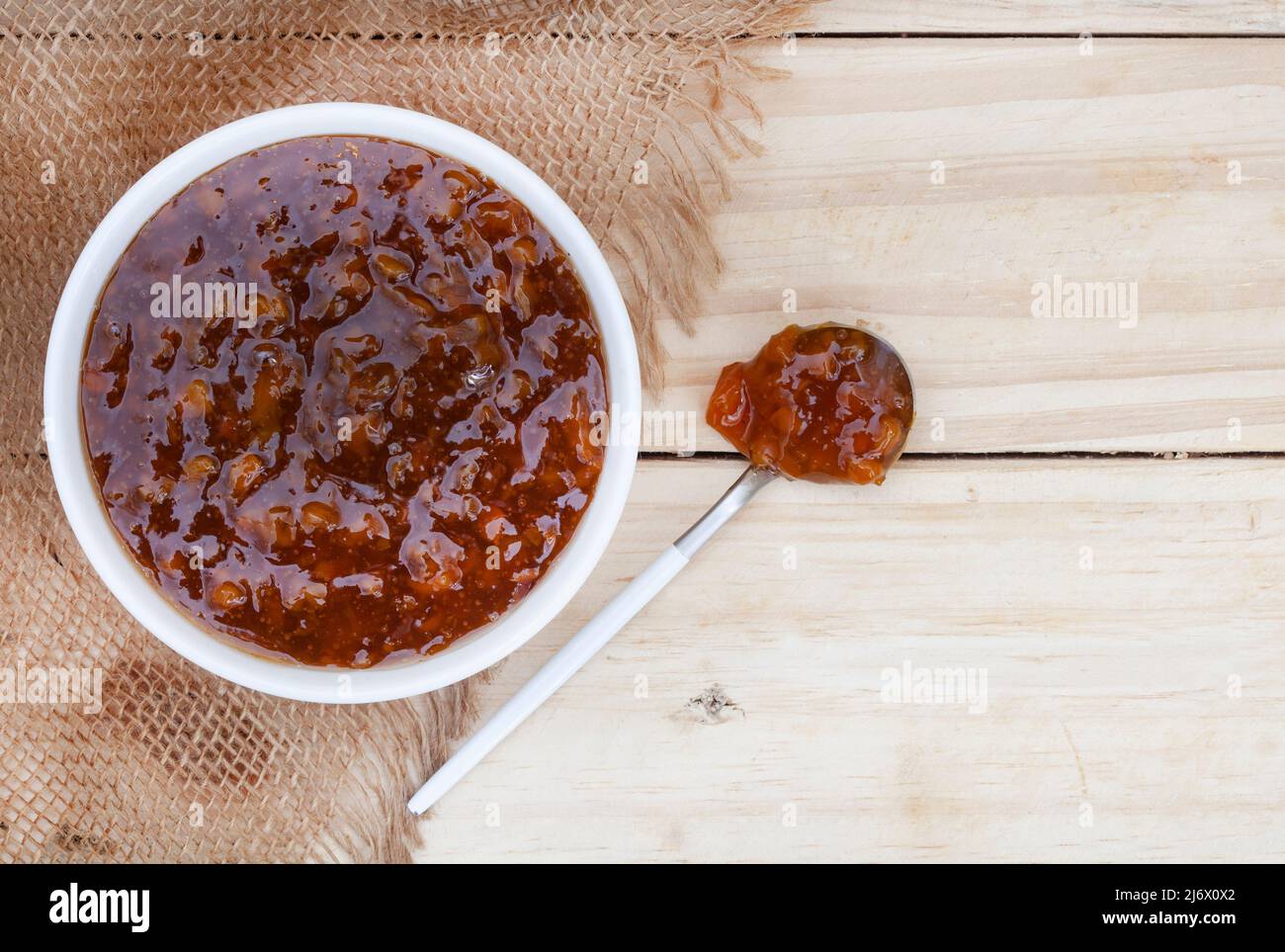 Traditional South African fruit chutney, a popular condiment in a white ...