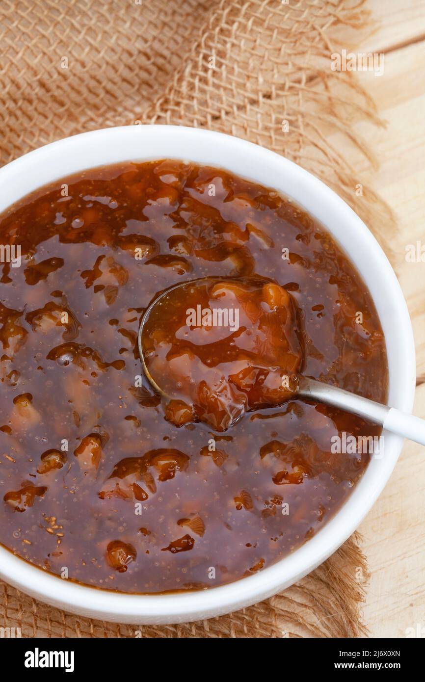 Traditional South African fruit chutney, a popular condiment in a white ...