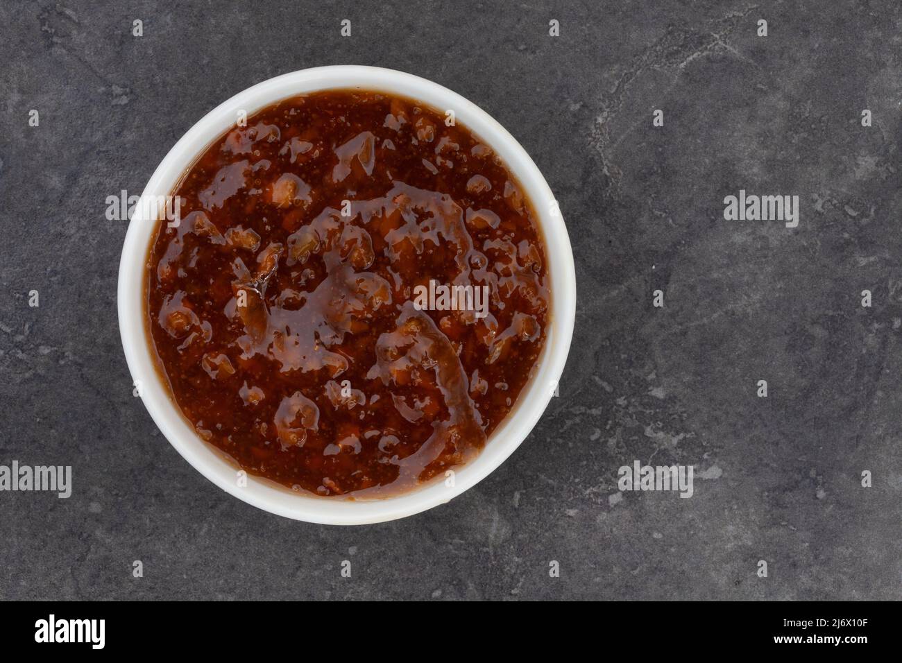 Traditional South African fruit chutney, a popular condiment in a white ...