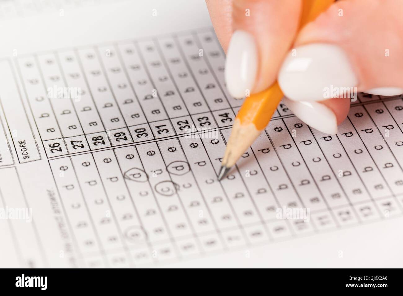 Female hand holds pencil and marks answers to test. Hiring Testing ...