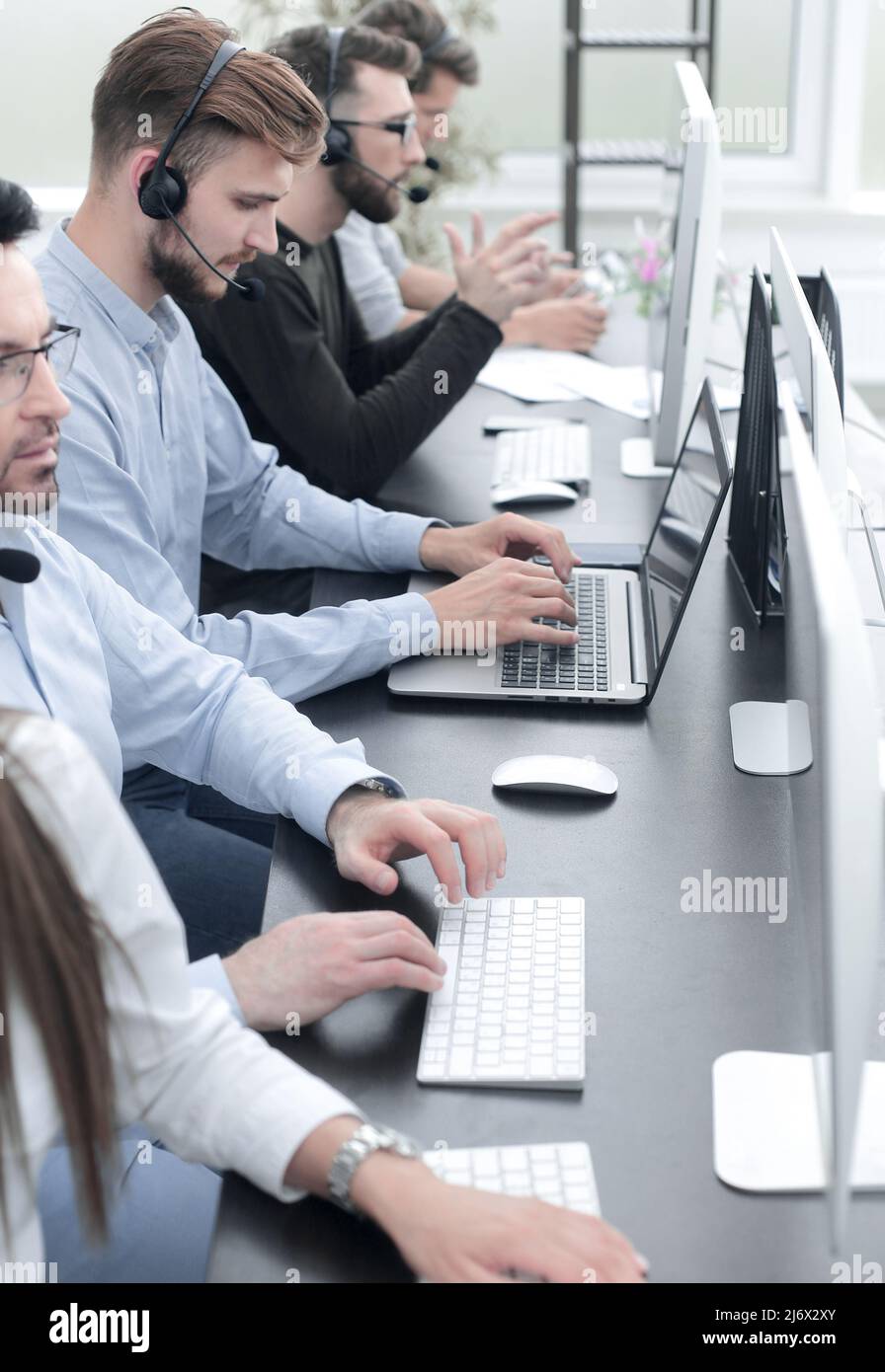 Call centre employees working on computers with their headset Stock ...