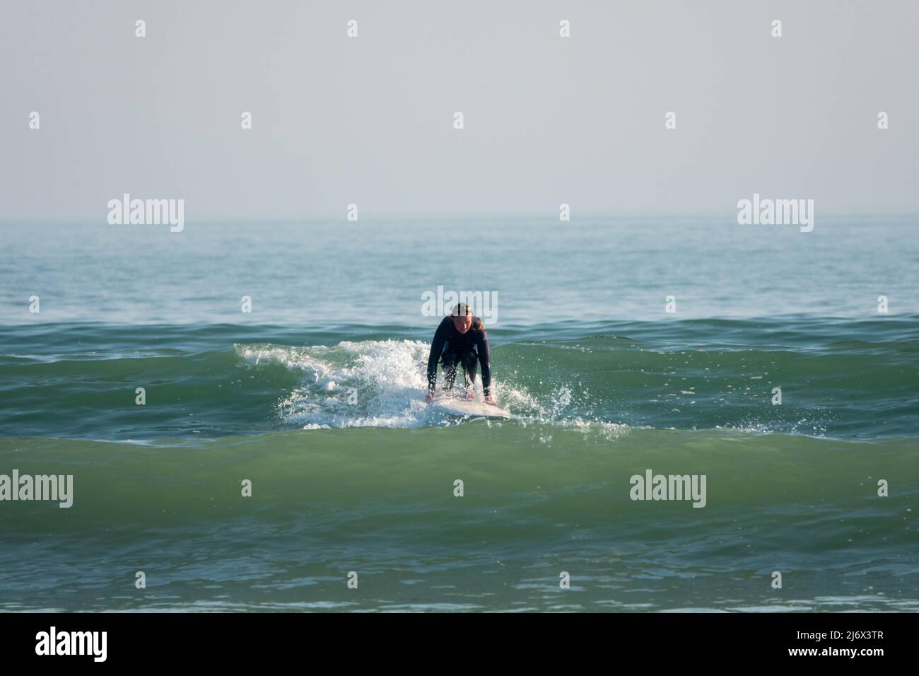 surfer riding the waves surface water sport Stock Photo - Alamy