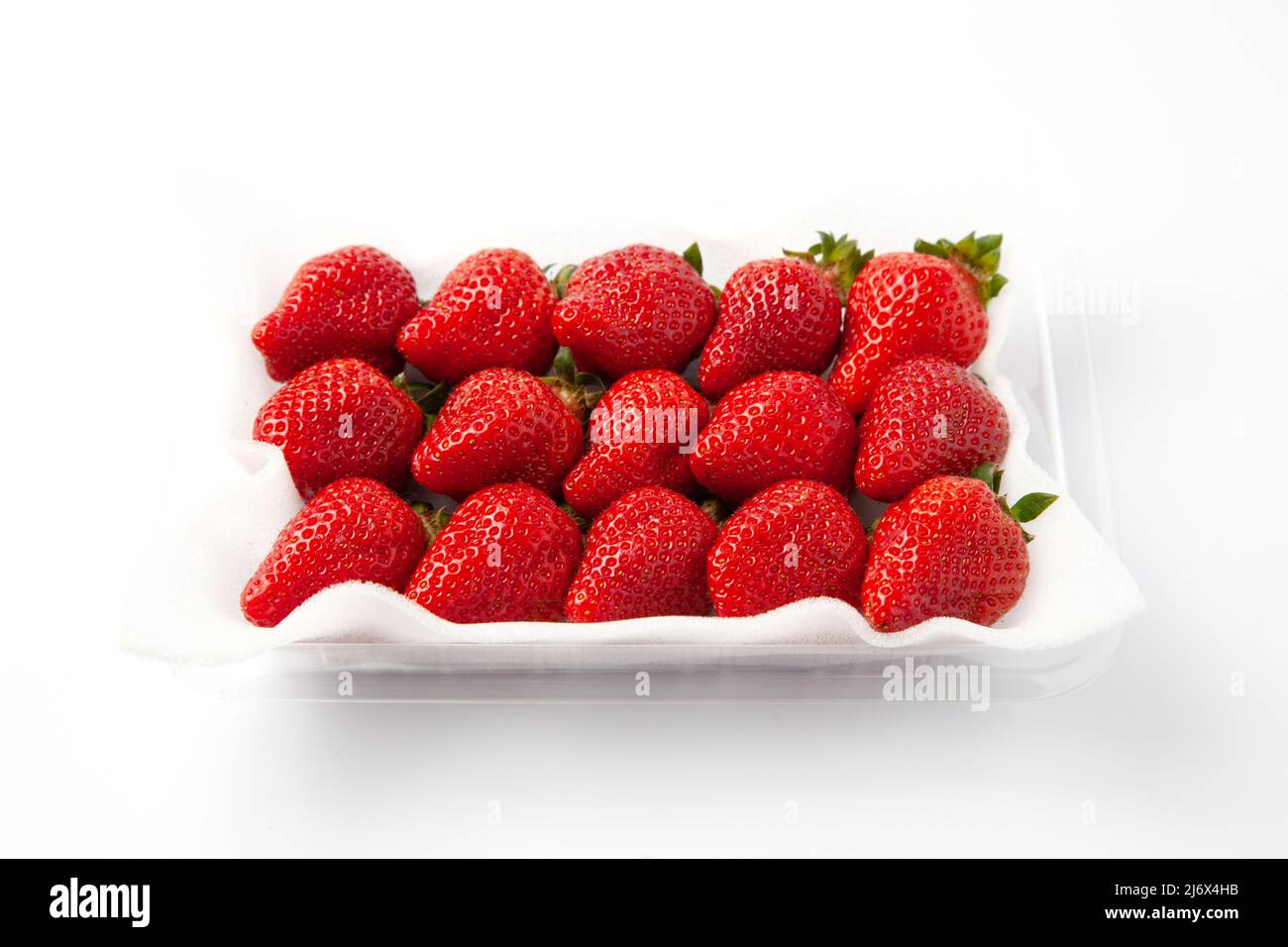 packed strawberries fruits isolated on white background Stock Photo - Alamy