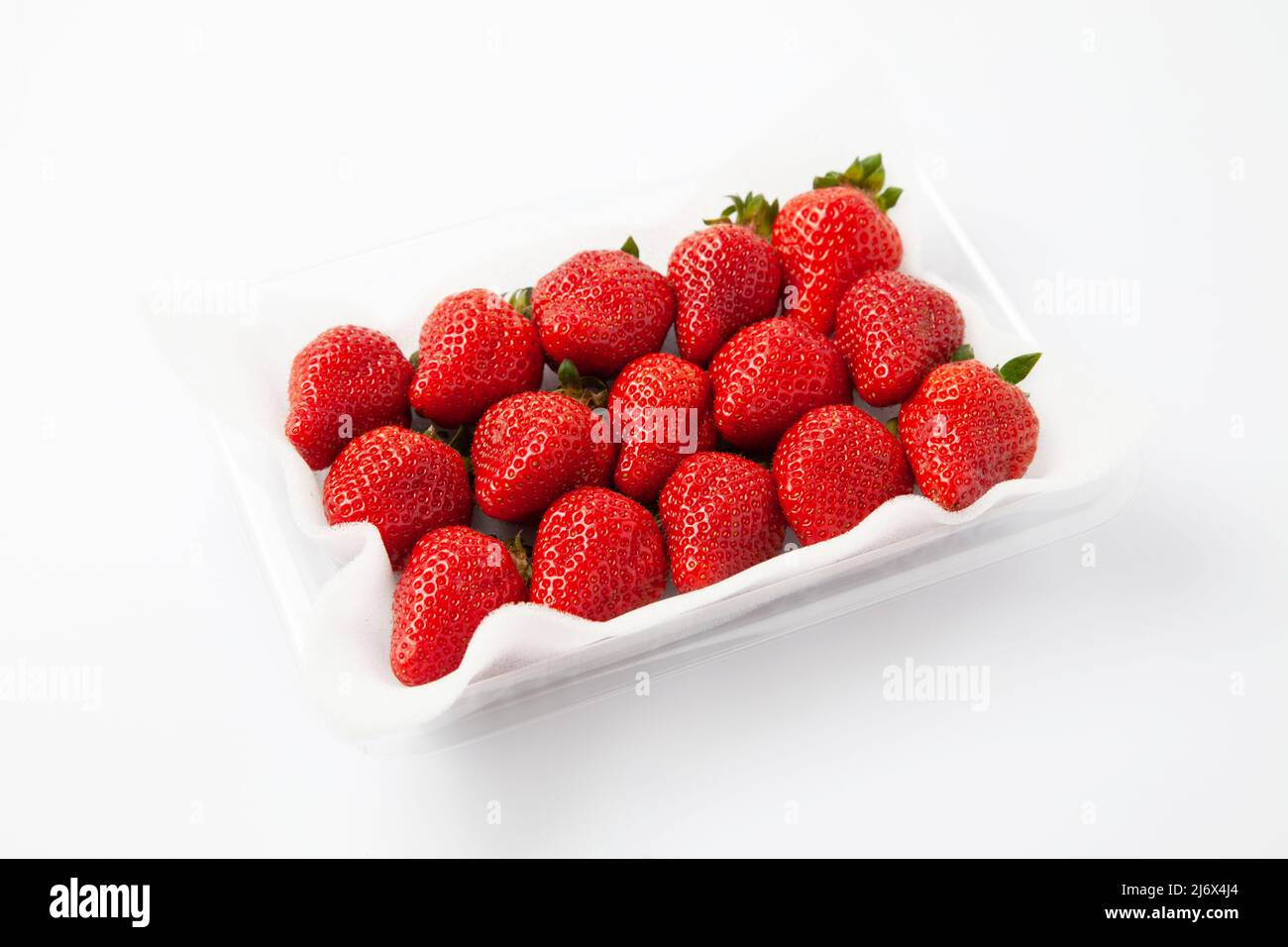packed strawberries fruits isolated on white background Stock Photo - Alamy