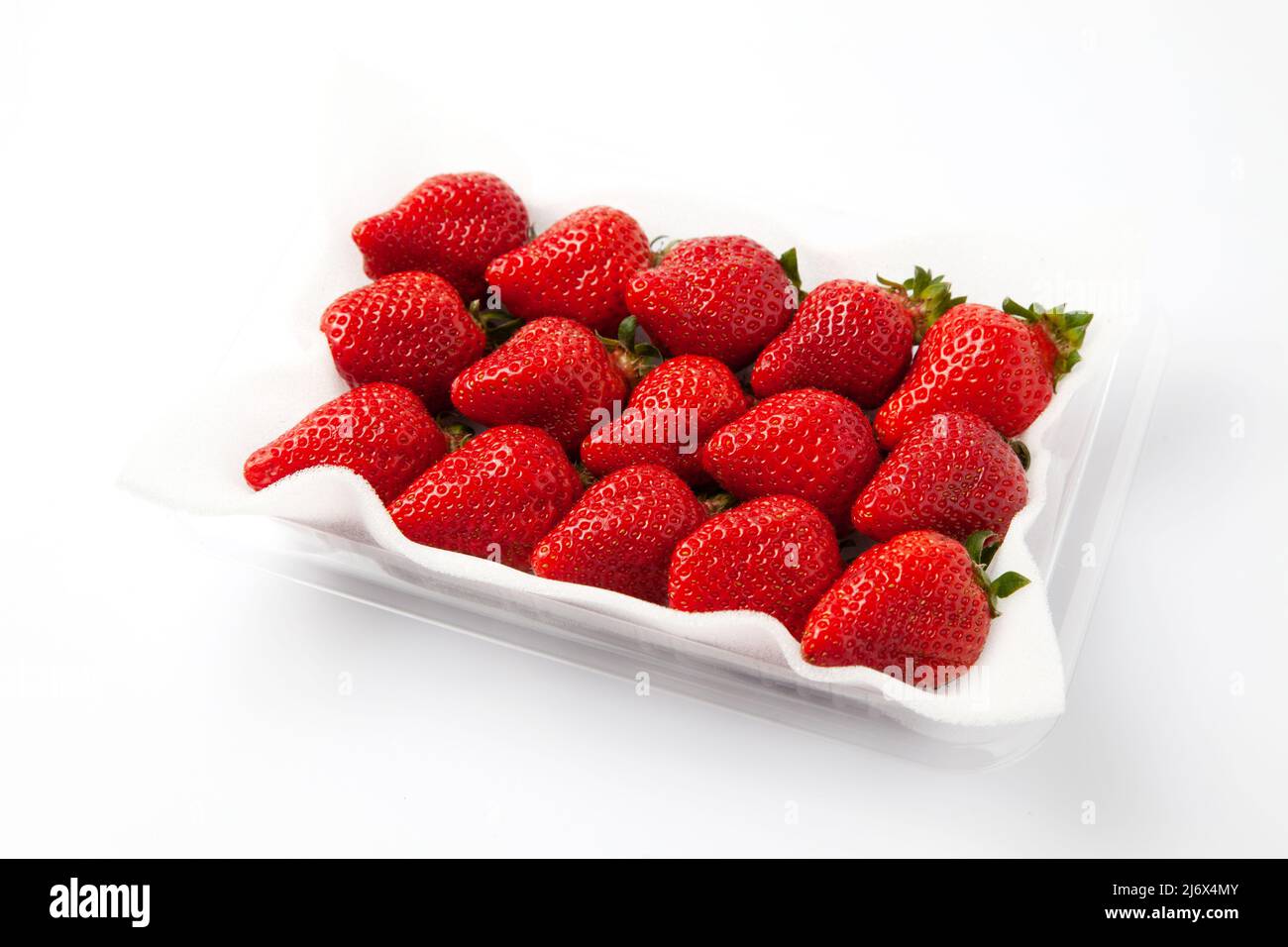 packed strawberries fruits isolated on white background Stock Photo - Alamy