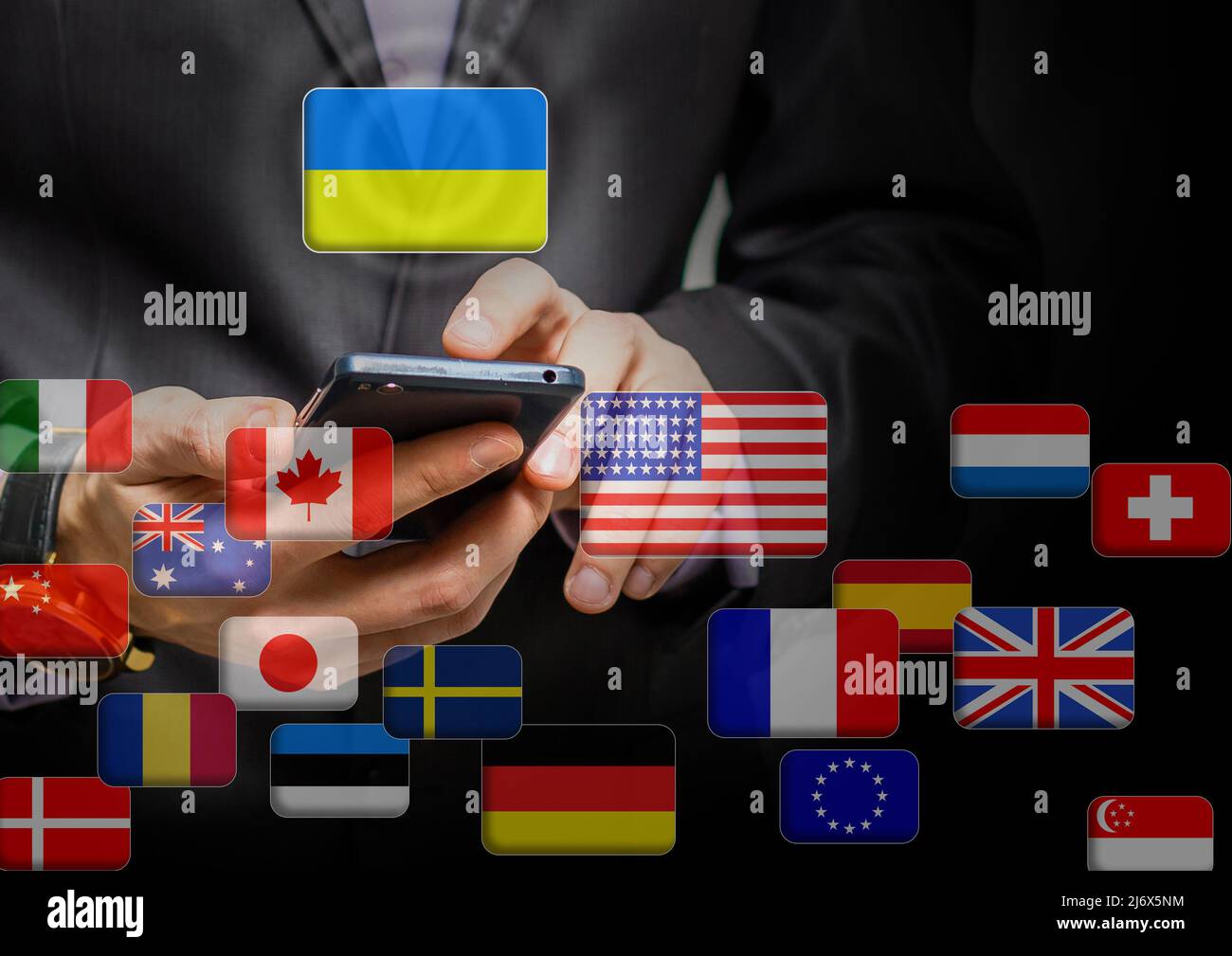 Hand pushing on a touch screen interface, choosing Ukraine. flags of ...