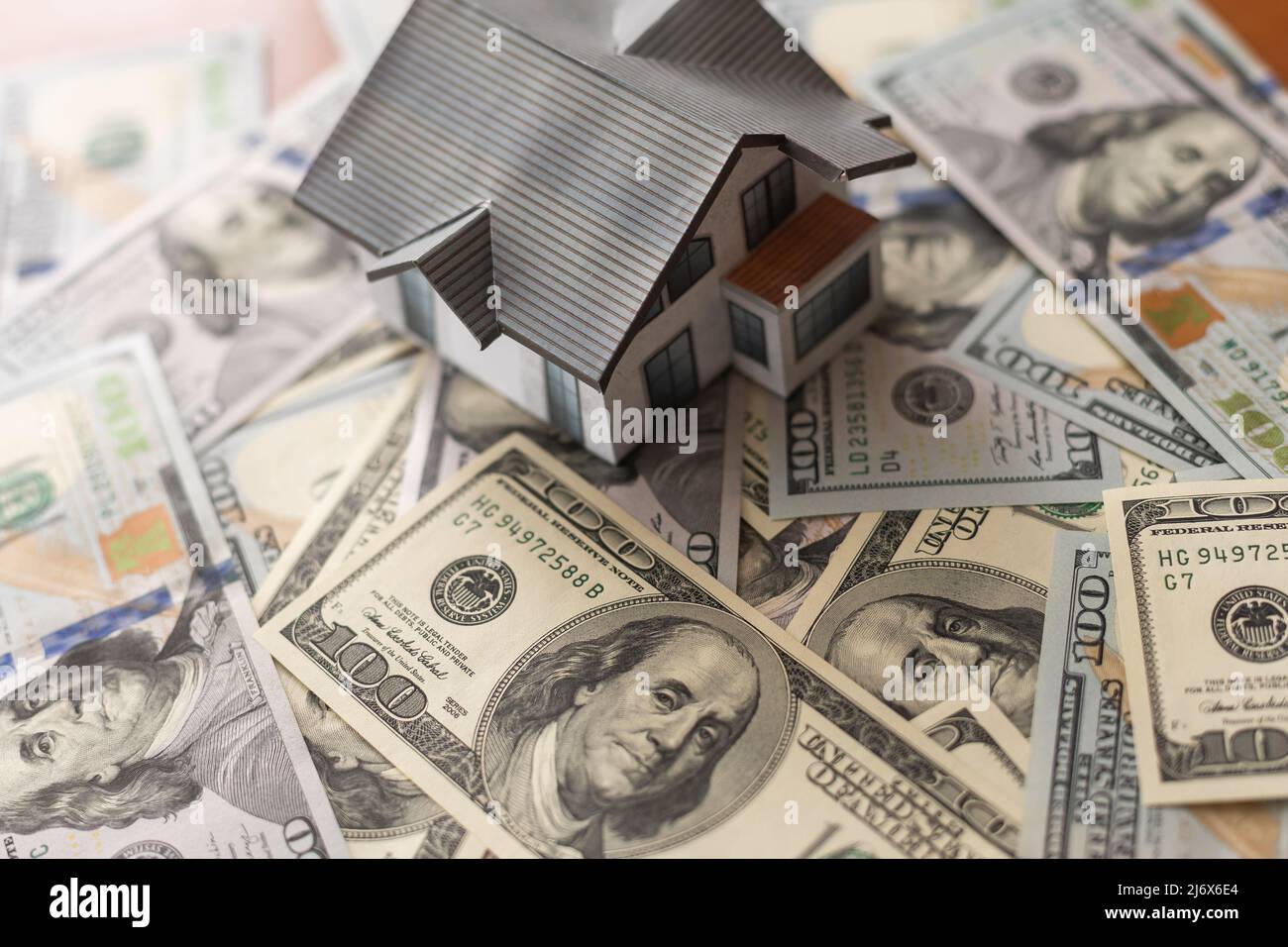Background from money. Scattered dollars. paper house Stock Photo - Alamy