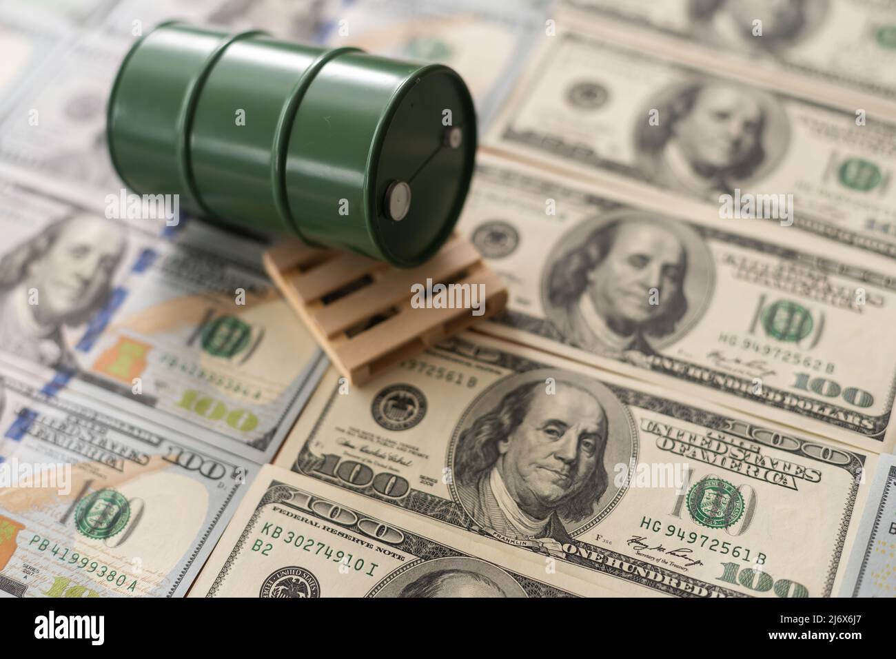 barrels of oil standing on the dollar bills of money. the oil business ...