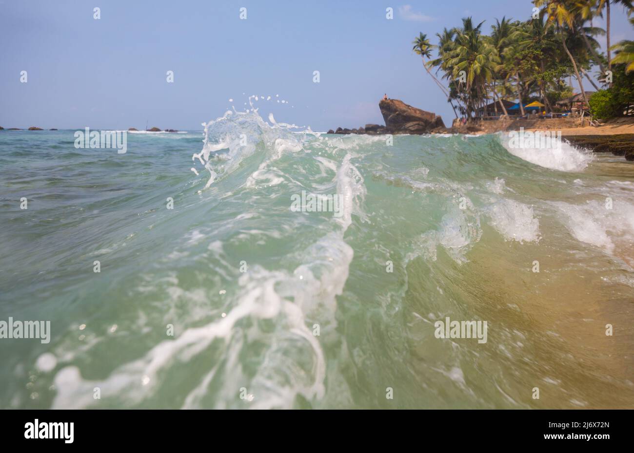 Blue wave on the beach. Dramatic natural background Stock Photo - Alamy