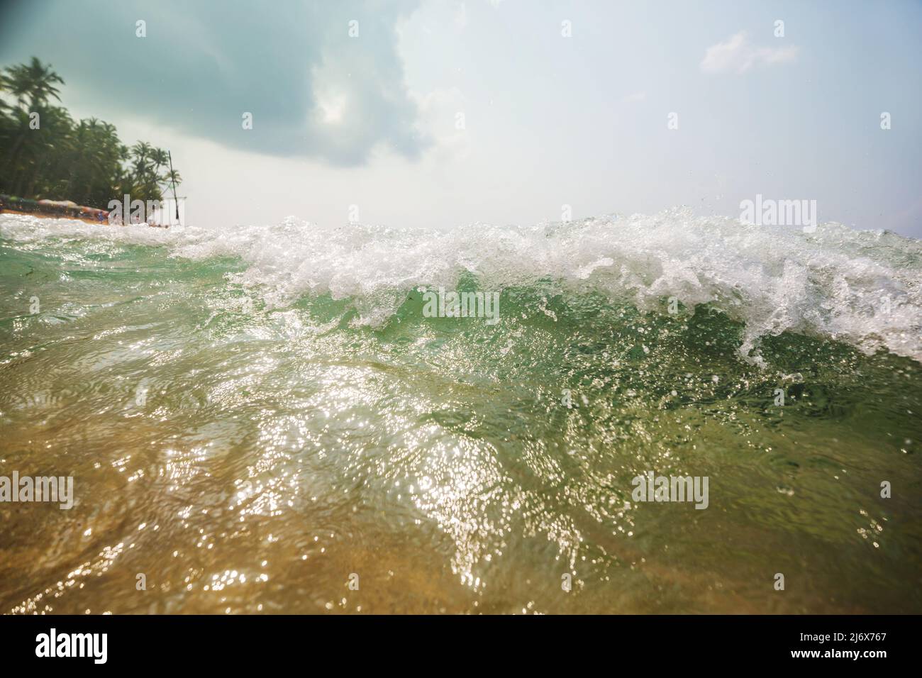 Blue wave on the beach. Dramatic natural background Stock Photo - Alamy
