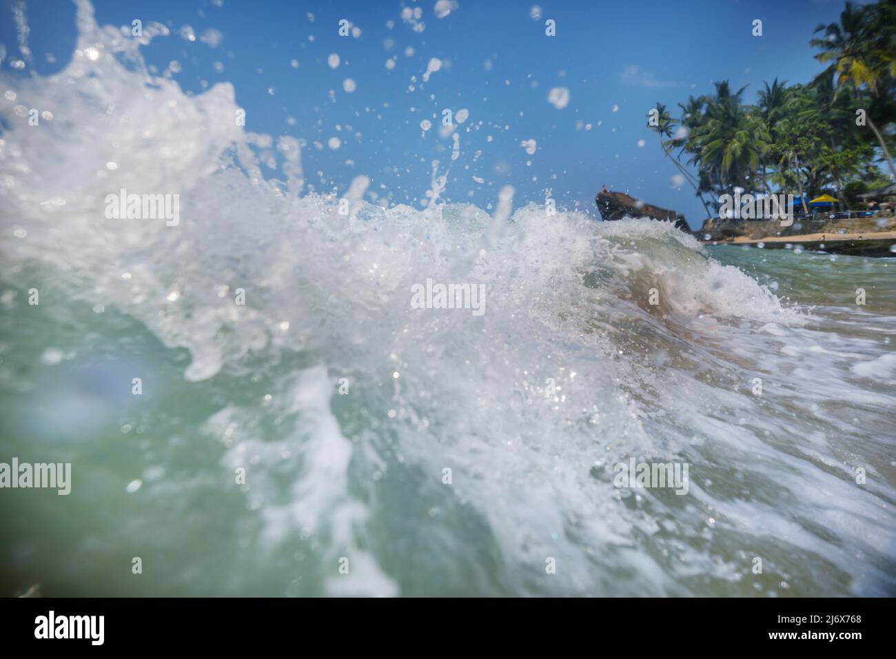 Blue wave on the beach. Dramatic natural background Stock Photo - Alamy