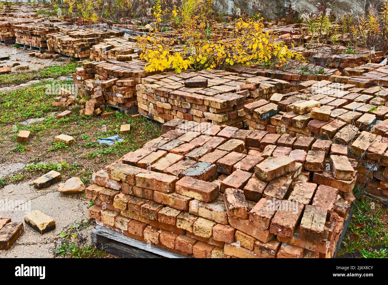 Stacks of old bricks for sale at site of abandoned old factory in ...