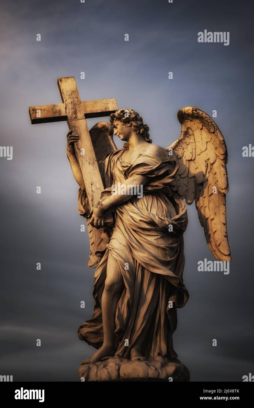 Angel Carrying the Cross statue at sunset on Ponte Sant Angelo bridge ...