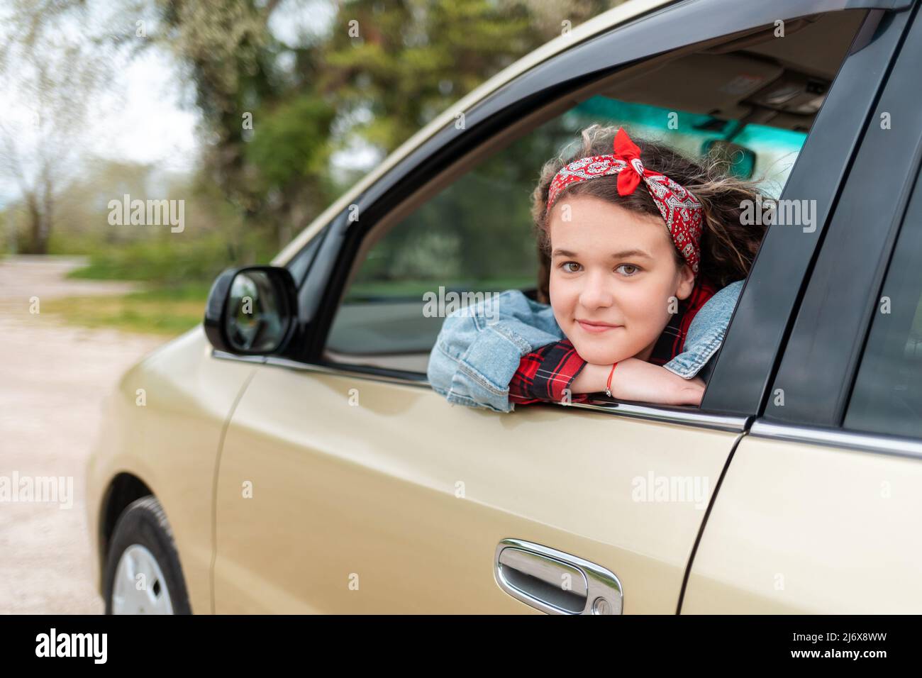 Obtaining a driver's license. Portrait of a cute smiling teenage girl ...