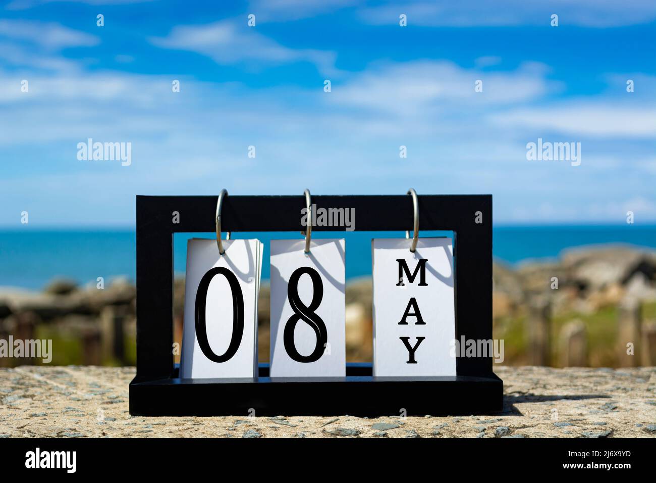May 8 calendar date text on wooden frame with blurred background of ...