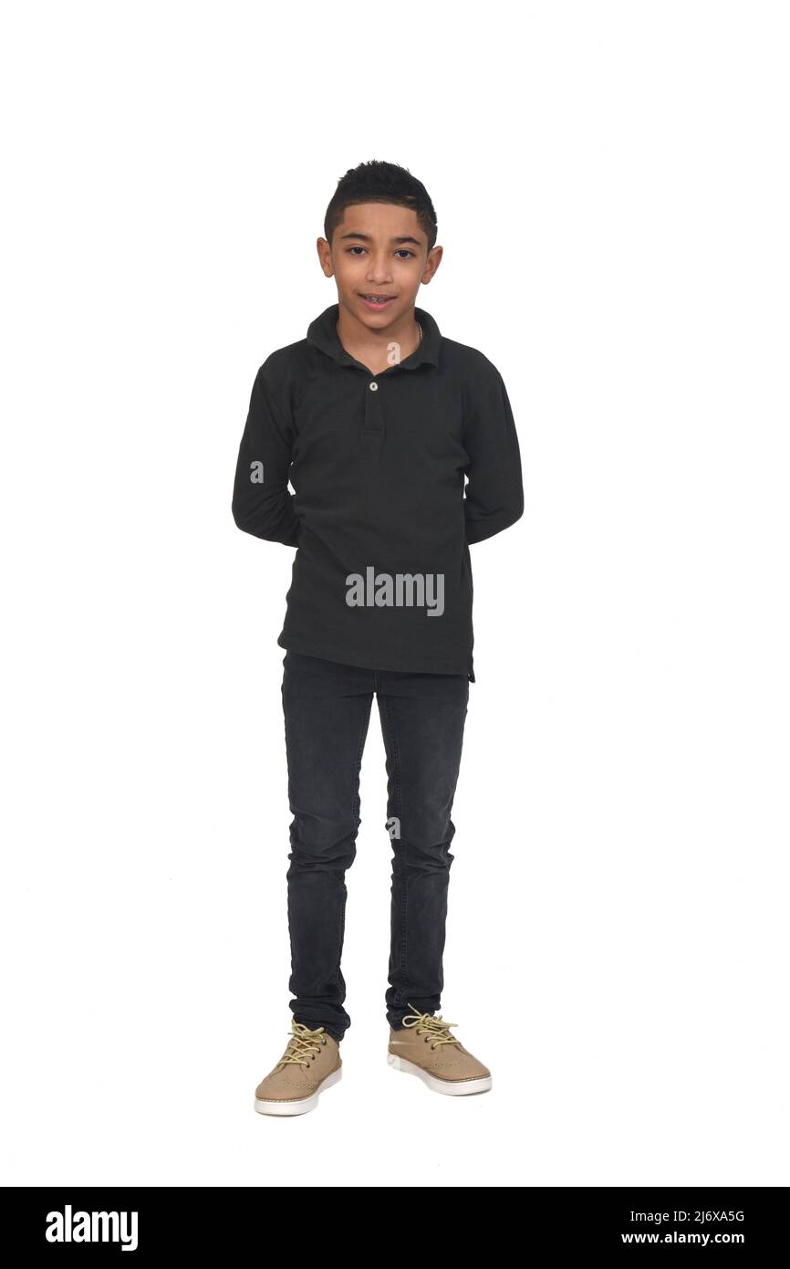 portrait of a boy with hands back looking at camera on white background ...