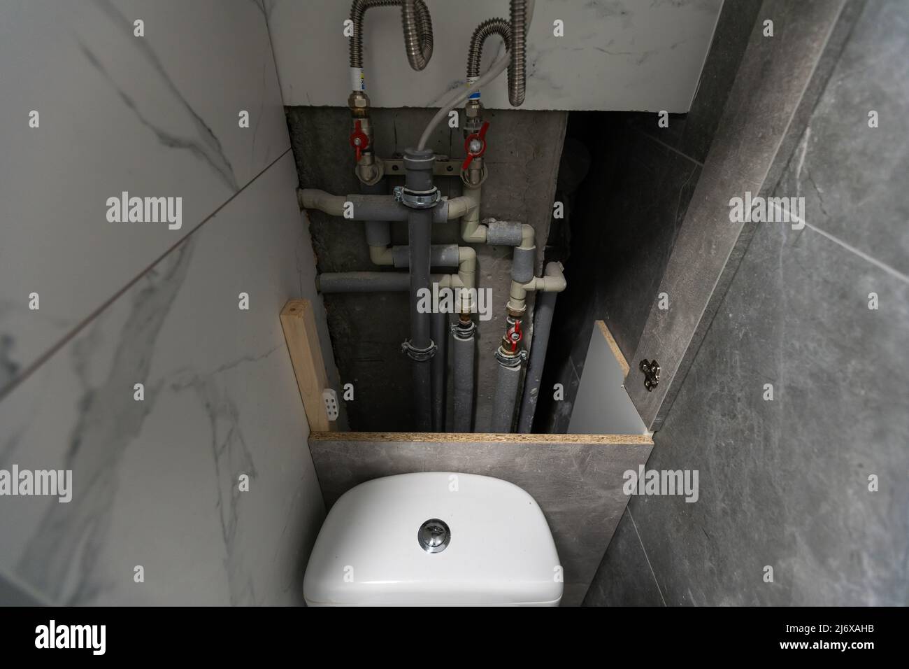 Water pipes, valves and manometers inside house, system with electric ...