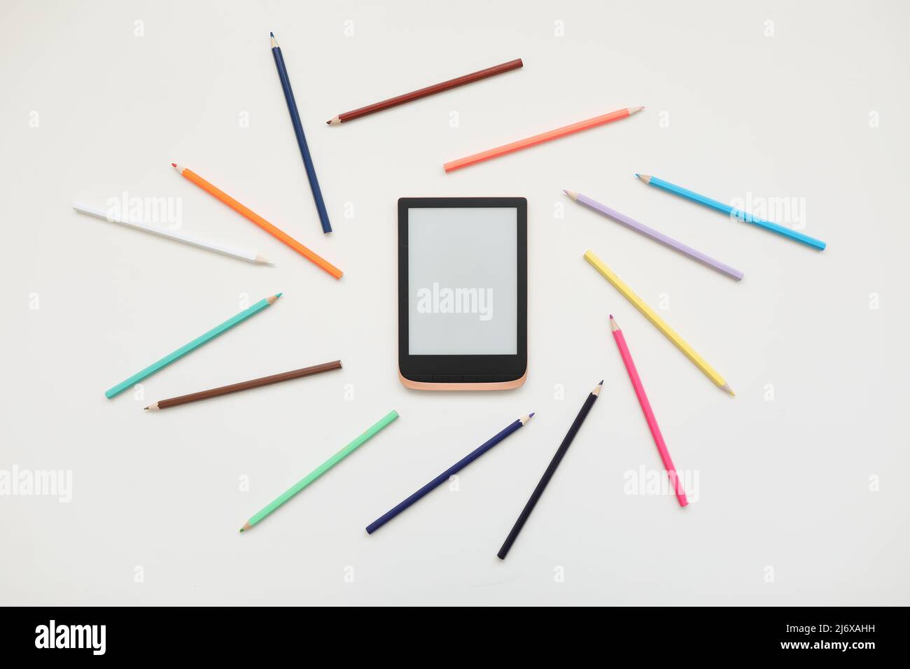 Digital tablet and colorful pencils on white background. Painting ...