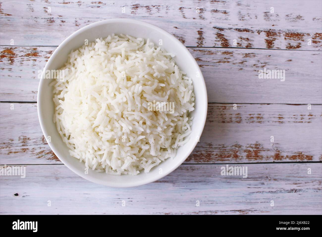 The bowl of cooked rice. photo on wooden background top view copy space ...