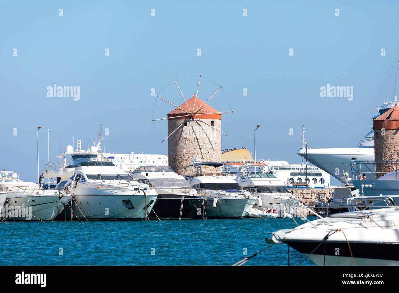 Windmills in the Mandraki port of Rhodes, Greece Stock Photo - Alamy