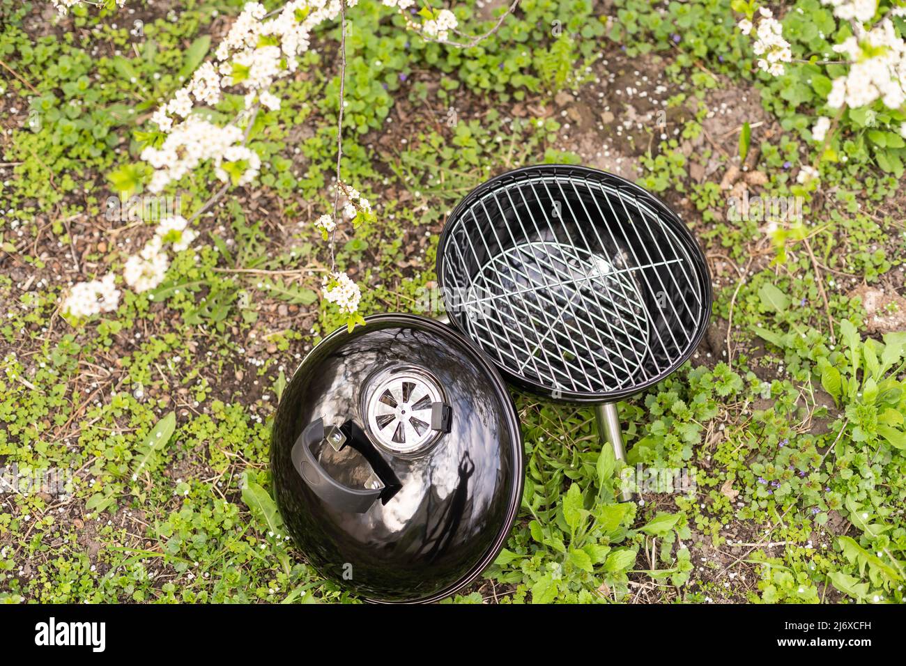 Empty Barbecue Grill Close-up In The Backyard Lawn At Summer Stock ...